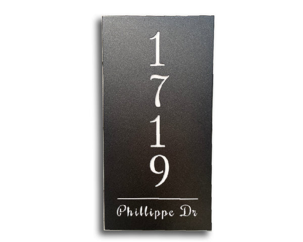 An illuminated Aluminum house sign that looks great during the day but