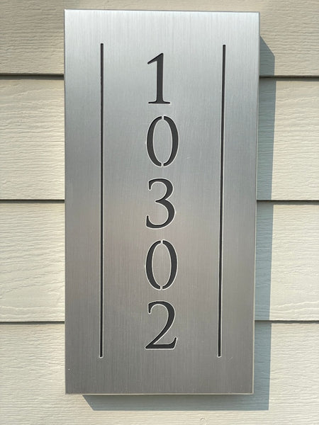An illuminated Aluminum house sign that looks great during the day but